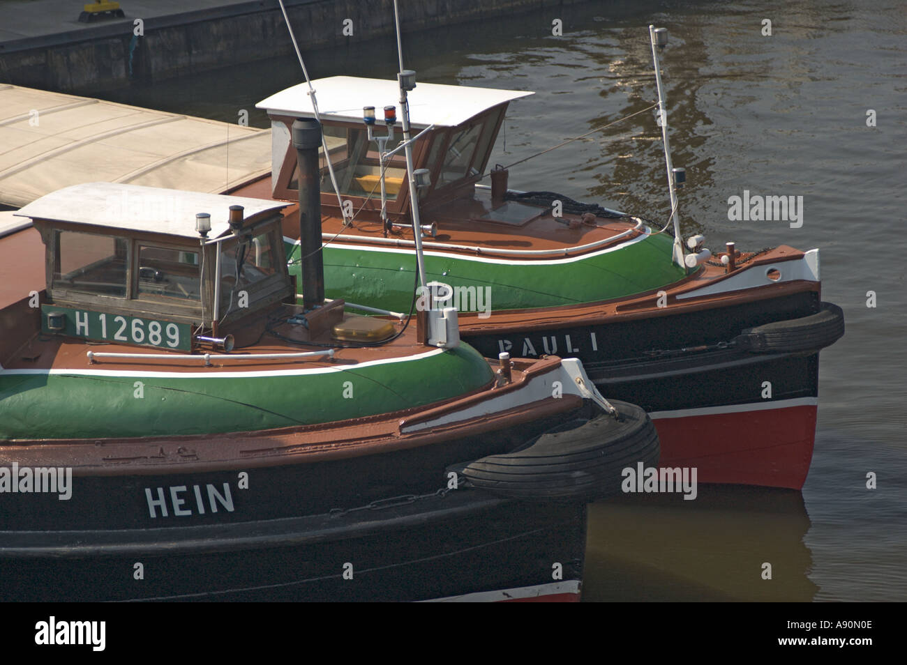 Two small trip boats ar lying side by side at Hamburg Harbour Germany ...