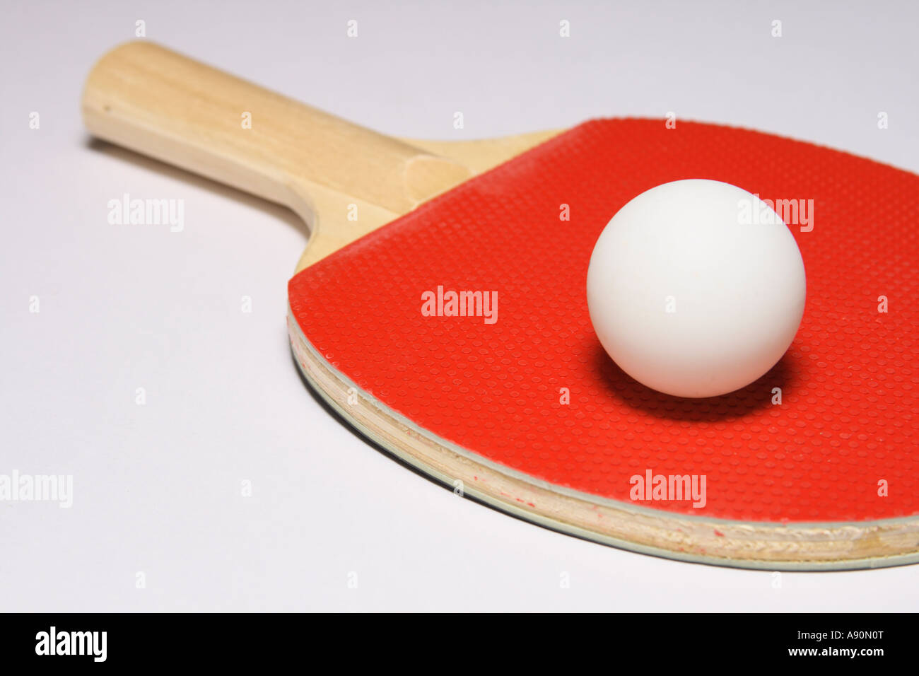 table tennis or ping pong bat with ball Stock Photo - Alamy
