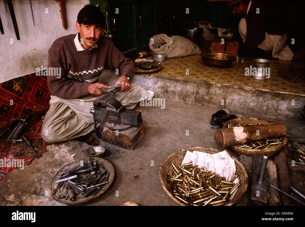 Pakistan NWFP Darra Adam Khel man filing gun component Stock Photo - Alamy