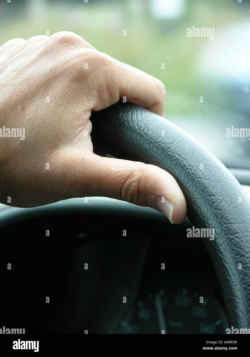 Detail of Hand On Steering Wheel Stock Photo - Alamy
