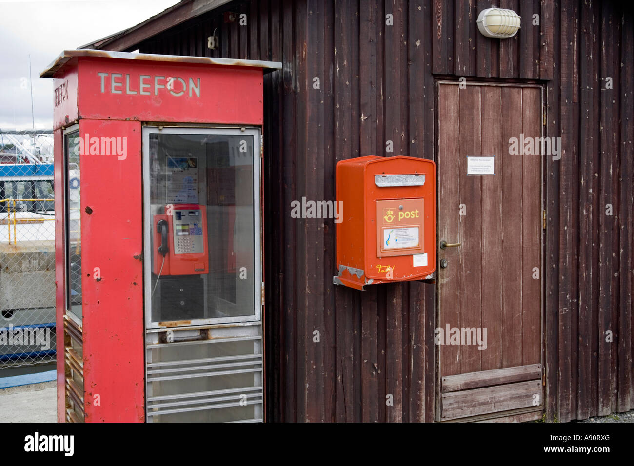 Telephone and post box on the dockside in Kirkenes Norway Stock Photo ...