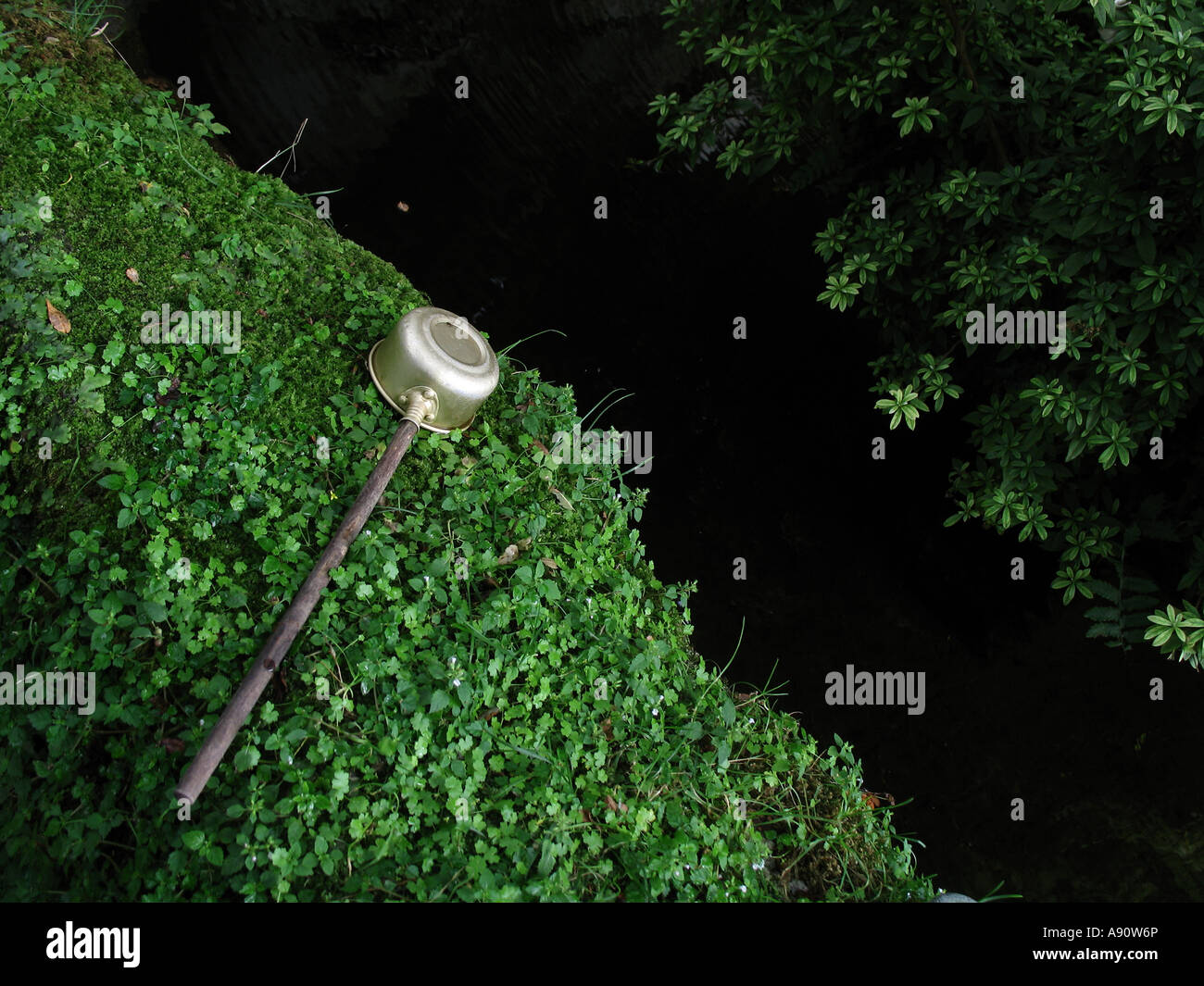 Ladle in the shrine Stock Photo - Alamy