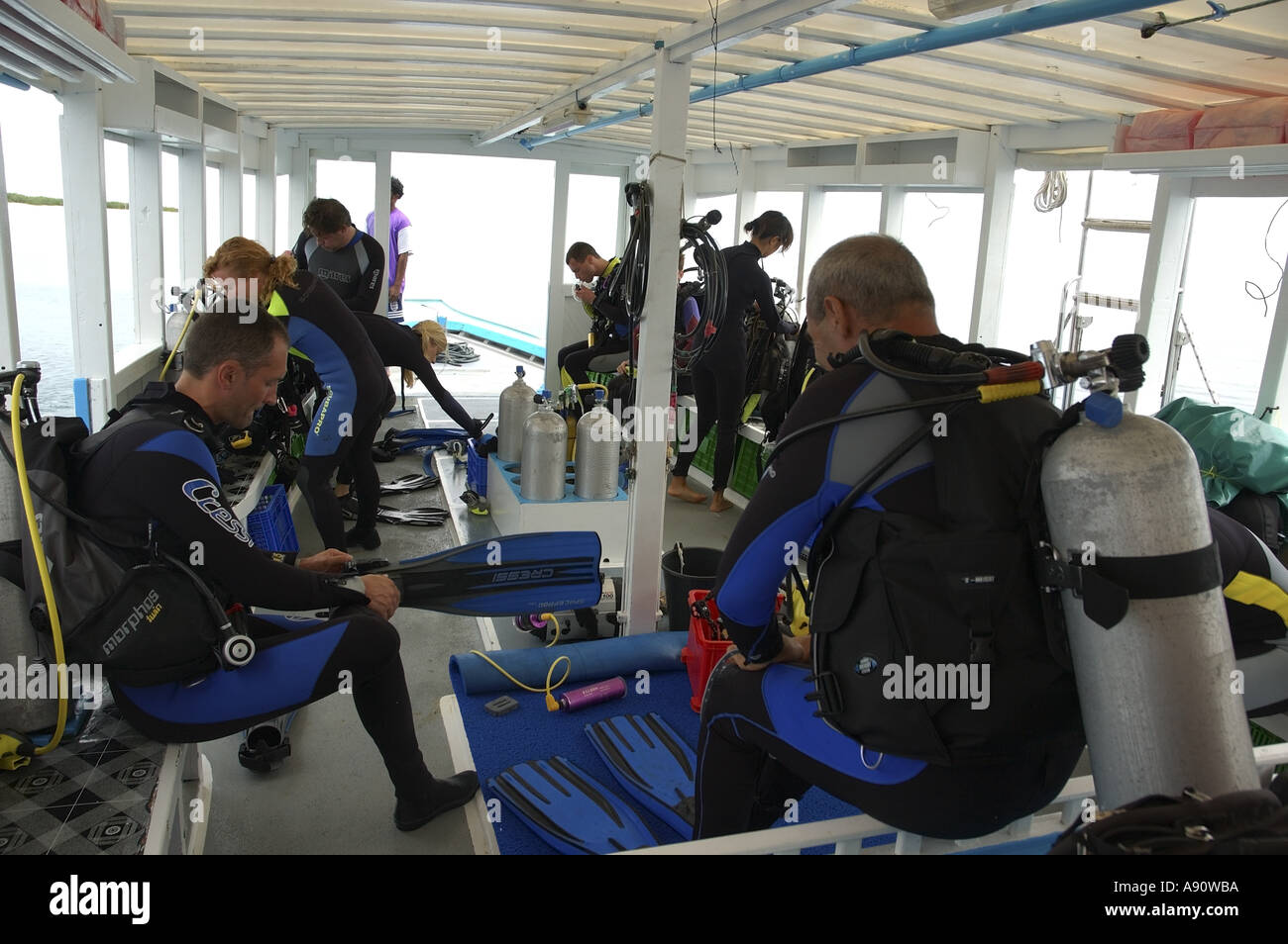 Divers on a boat deck preparing to dive on a shipwreck, Maldives Stock ...