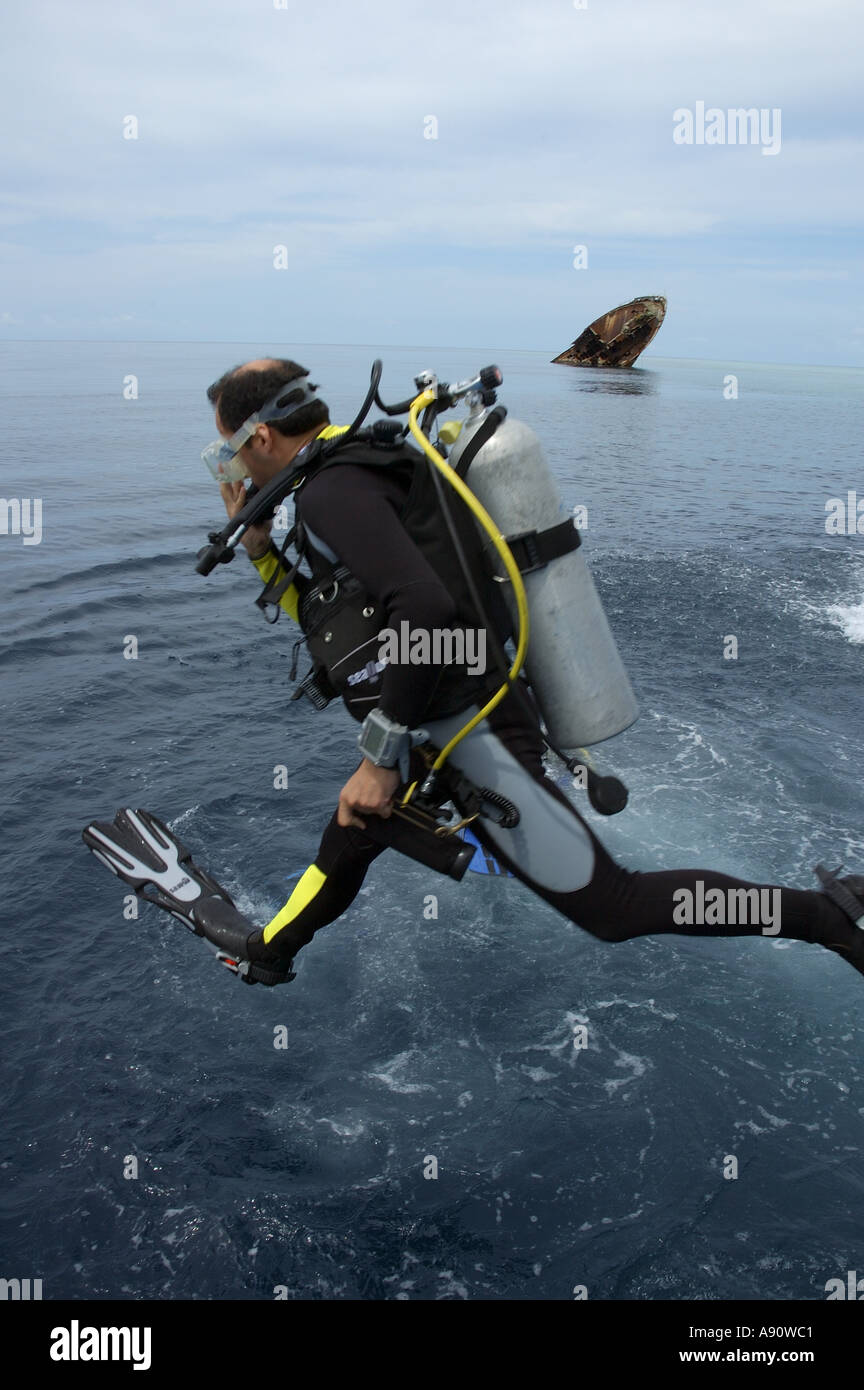Diver Jumping From A Dhoni Boat To Dive On A Shipwreck Stock Photo - Alamy