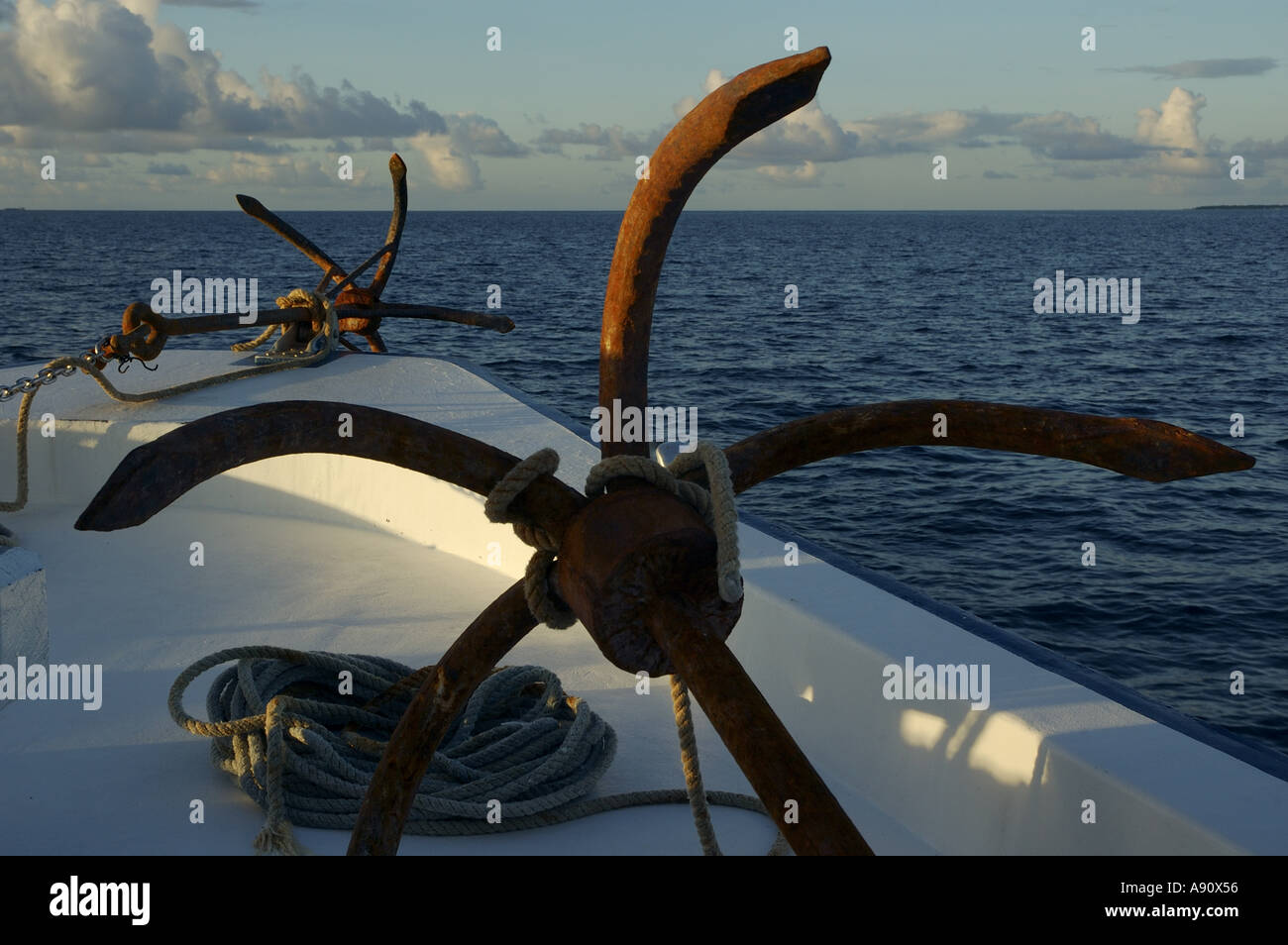 Rusty anchors on a boat's bow at sunset, Maldives Stock Photo - Alamy