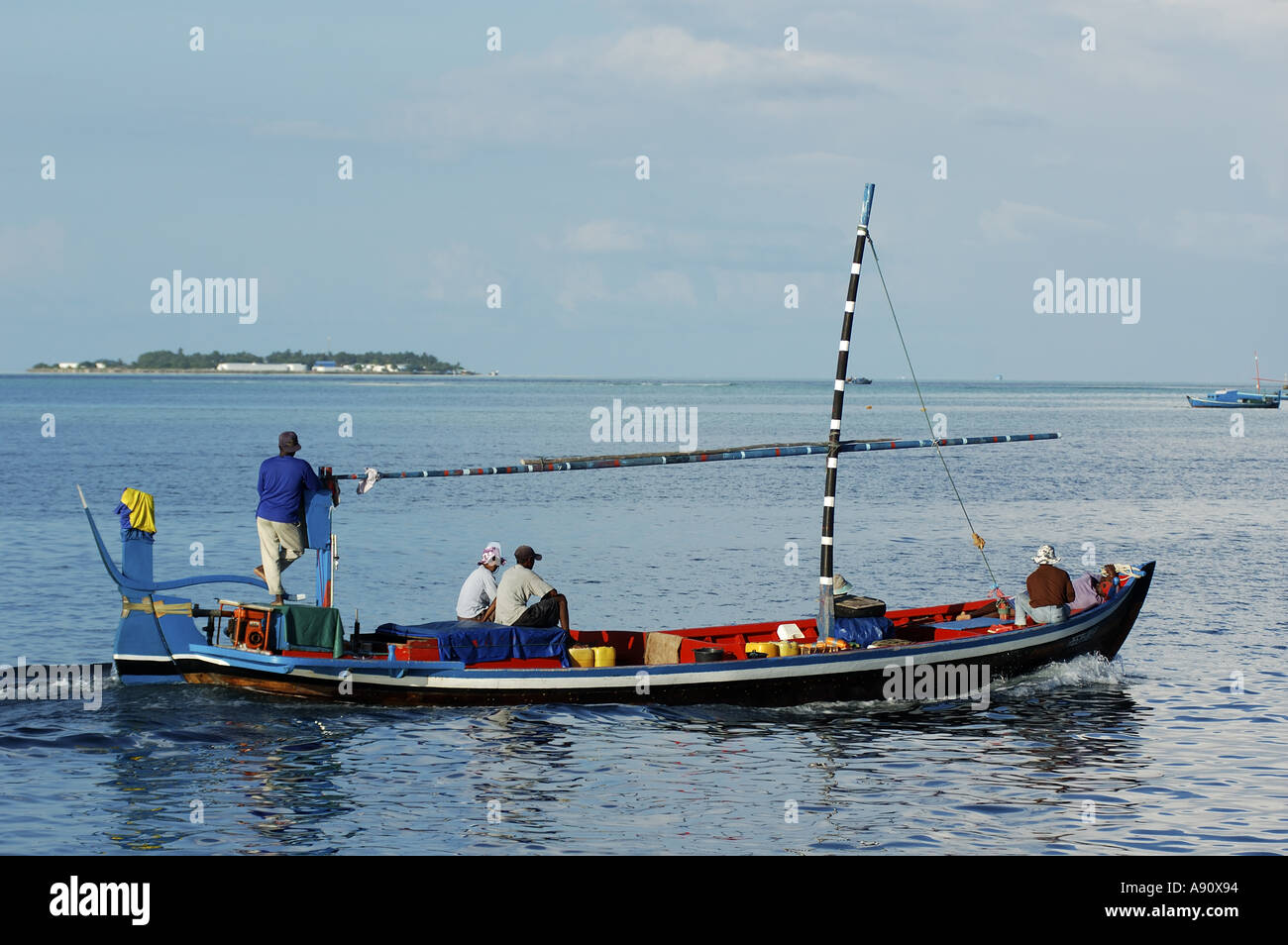 Maldives Fishermen On A Typical Dhoni Boat Cruising Stock Photo - Alamy