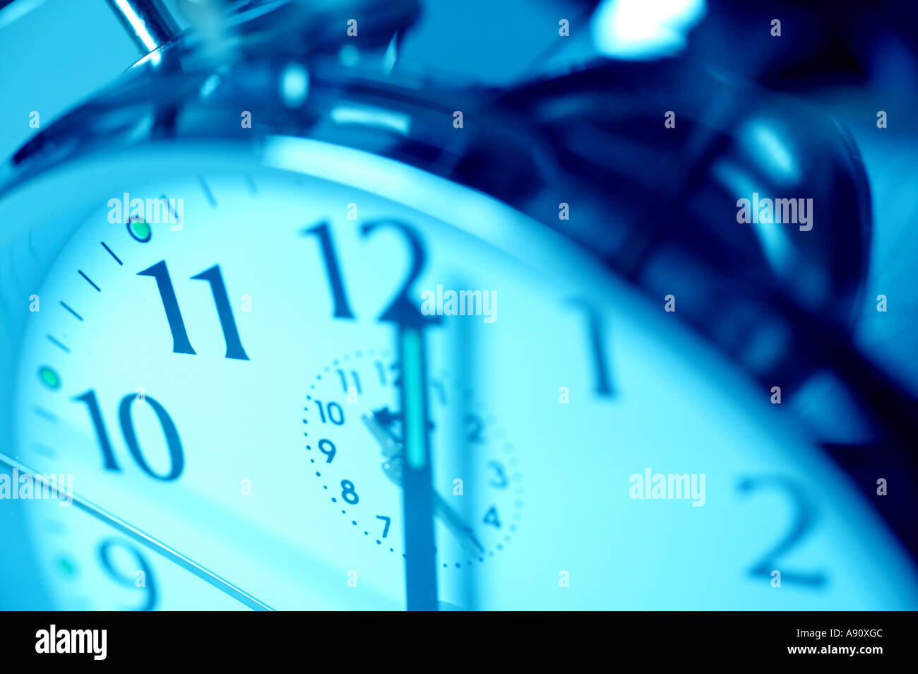 Blue alarm clock Stock Photo - Alamy
