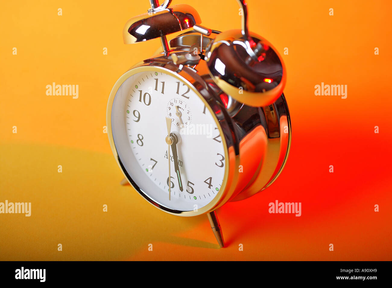 Orange alarm clock Stock Photo - Alamy