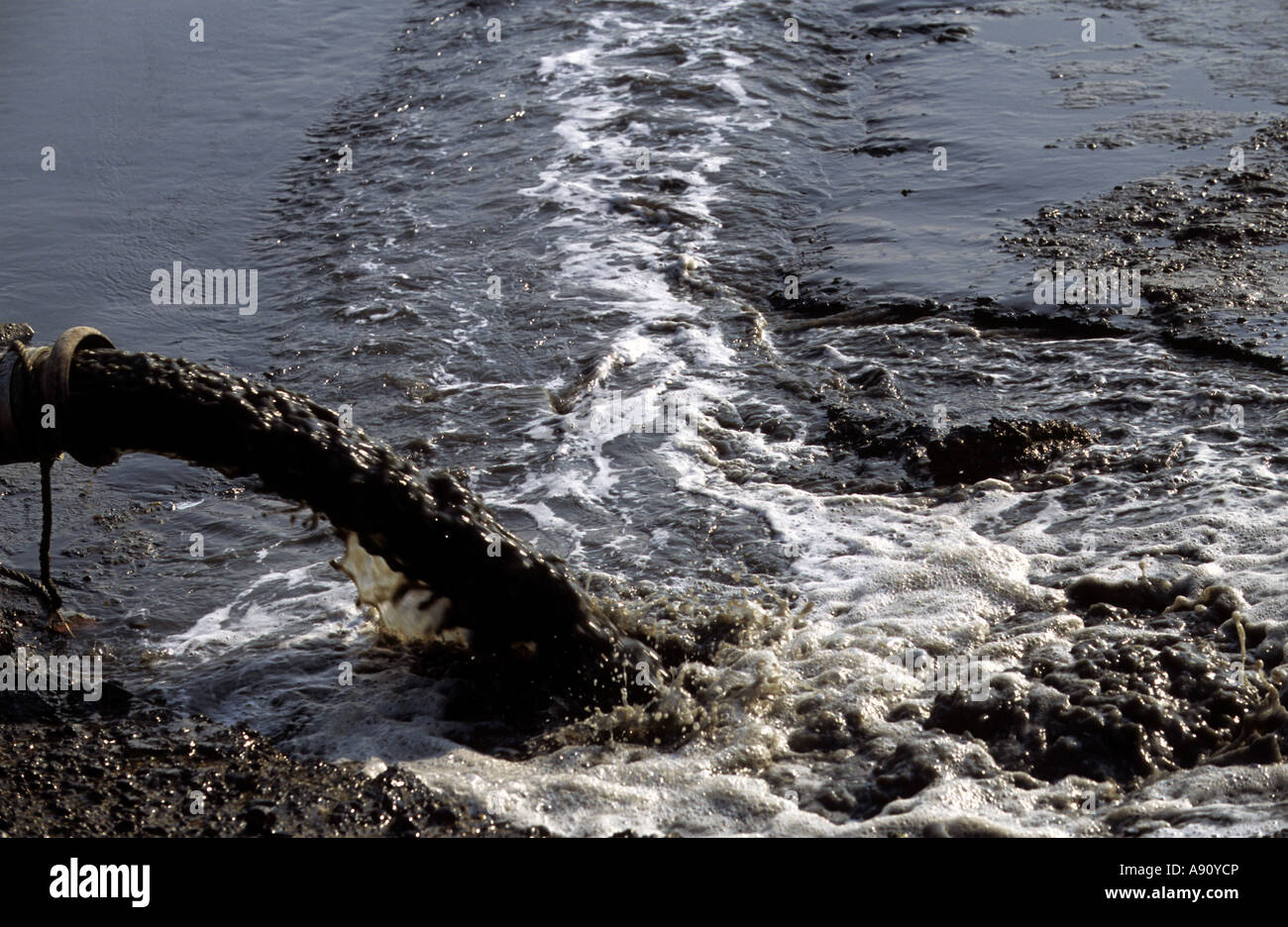 Dirty water from a flooded industrial estate being pumped into the ...
