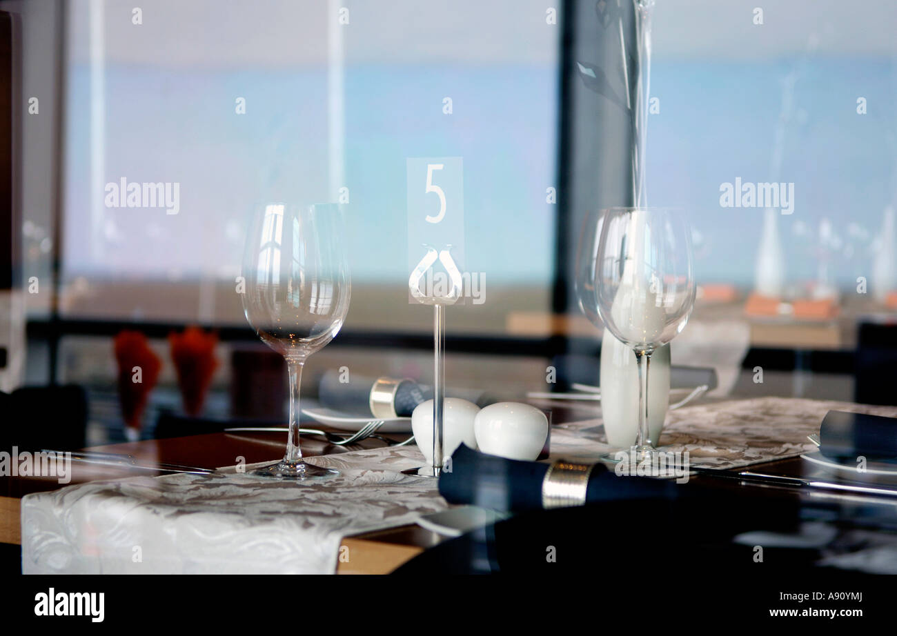 Reflection of tables through window of restaurant Stock Photo - Alamy