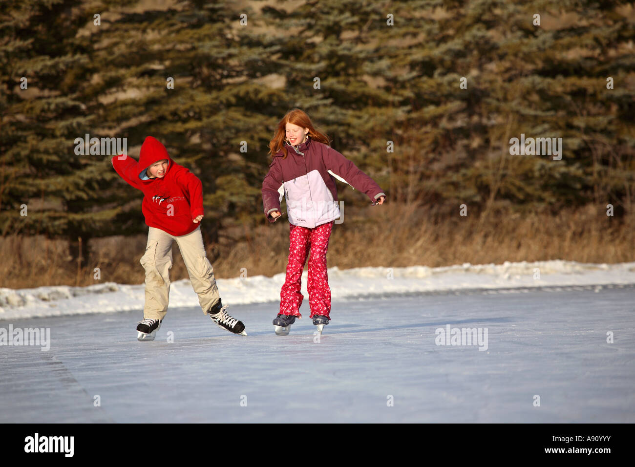 Children skating on outdoor ice in Moose Jaw Stock Photo - Alamy