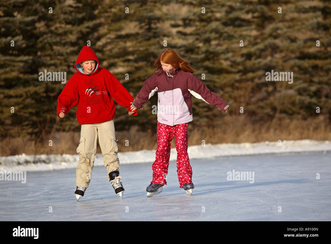 Boy skating on outdoor ice in moose jaw hi-res stock photography and ...