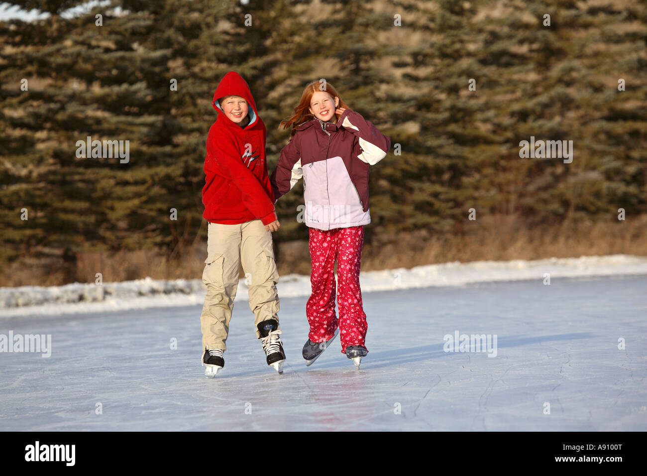 Children skating on outdoor ice in Moose Jaw Stock Photo - Alamy