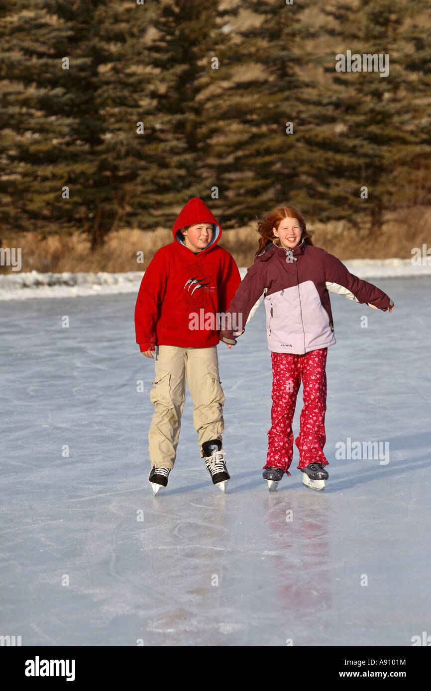 Children skating on outdoor ice in Moose Jaw Stock Photo - Alamy