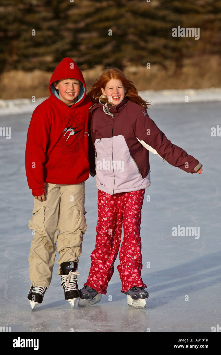 Children skating on outdoor ice in Moose Jaw Stock Photo - Alamy