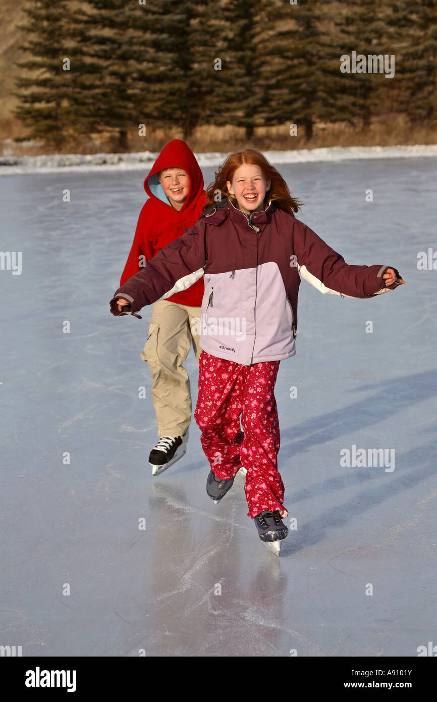 Children skating on outdoor ice in Moose Jaw Stock Photo - Alamy