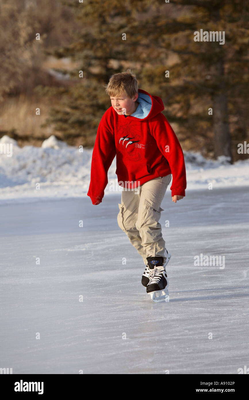 Boy skating on outdoor ice in moose jaw hi-res stock photography and ...