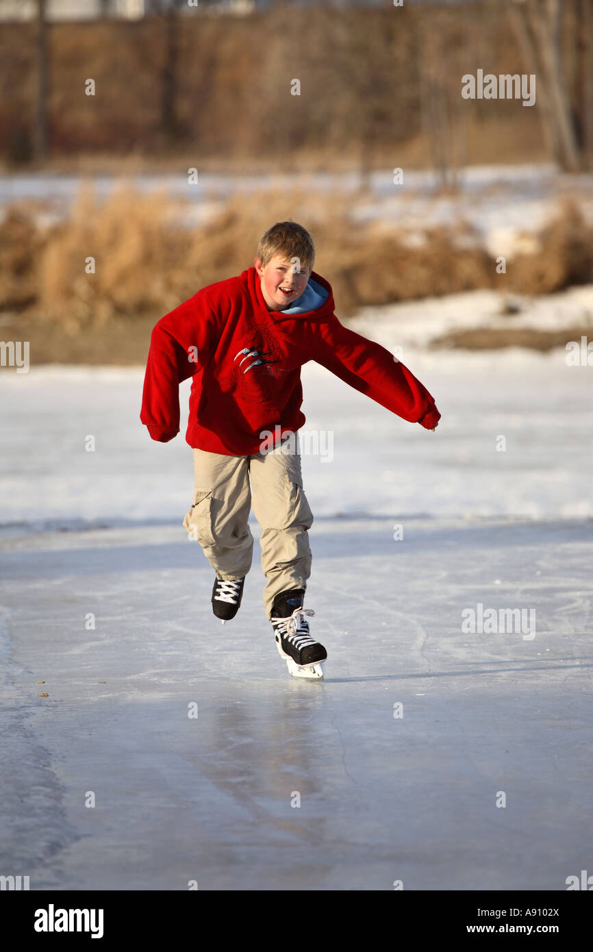 Boy ice skating hi-res stock photography and images - Alamy
