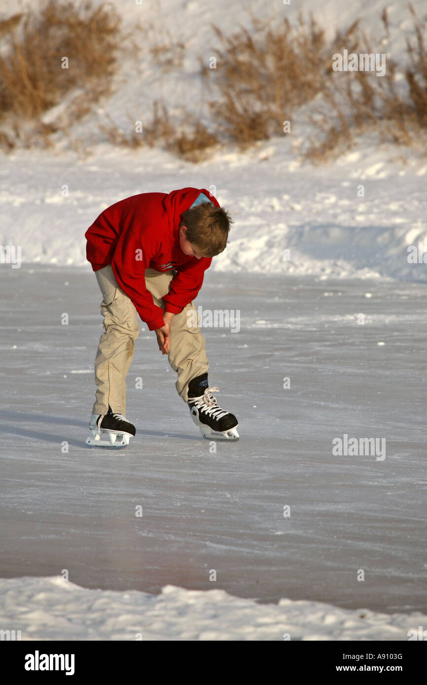 Boy skating on outdoor ice in moose jaw hi-res stock photography and ...