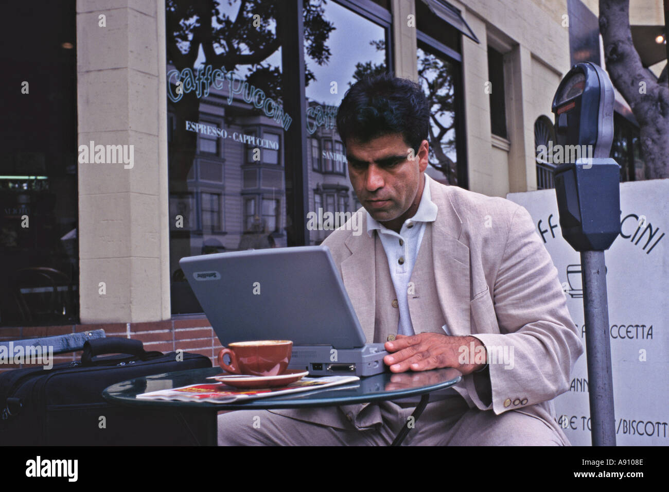 Working on computer outside hi-res stock photography and images - Alamy