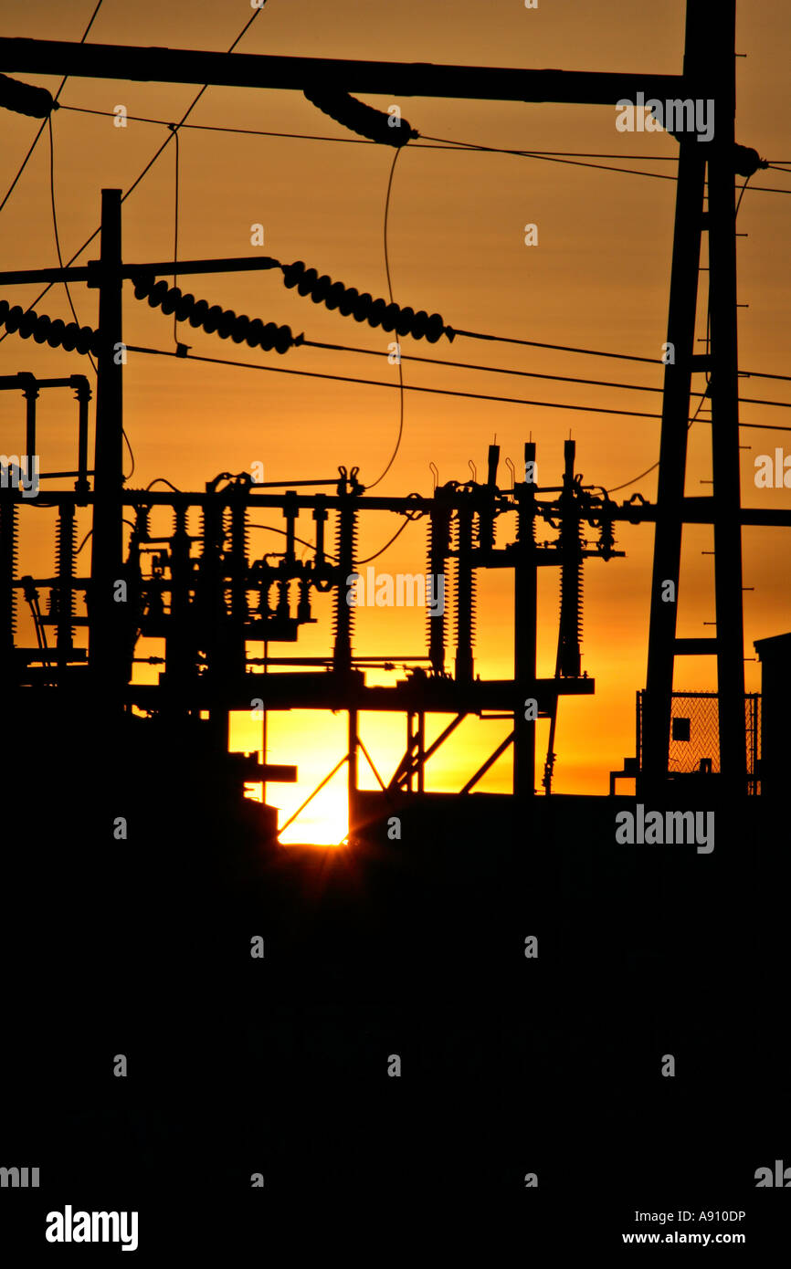 Sun setting behind power transformers Stock Photo - Alamy