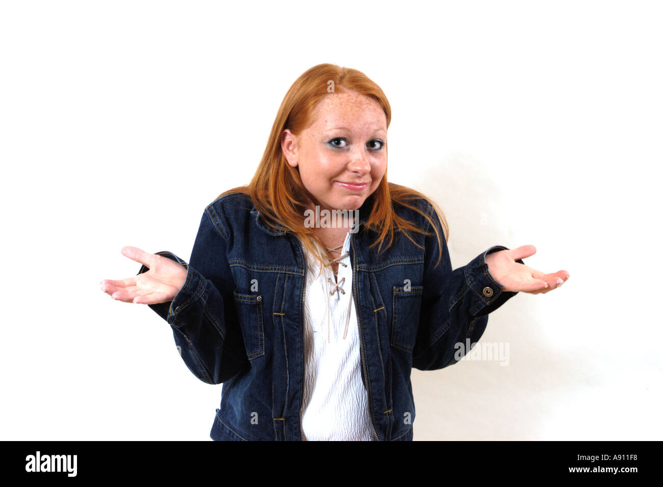 Young woman with hands up from side Stock Photo - Alamy