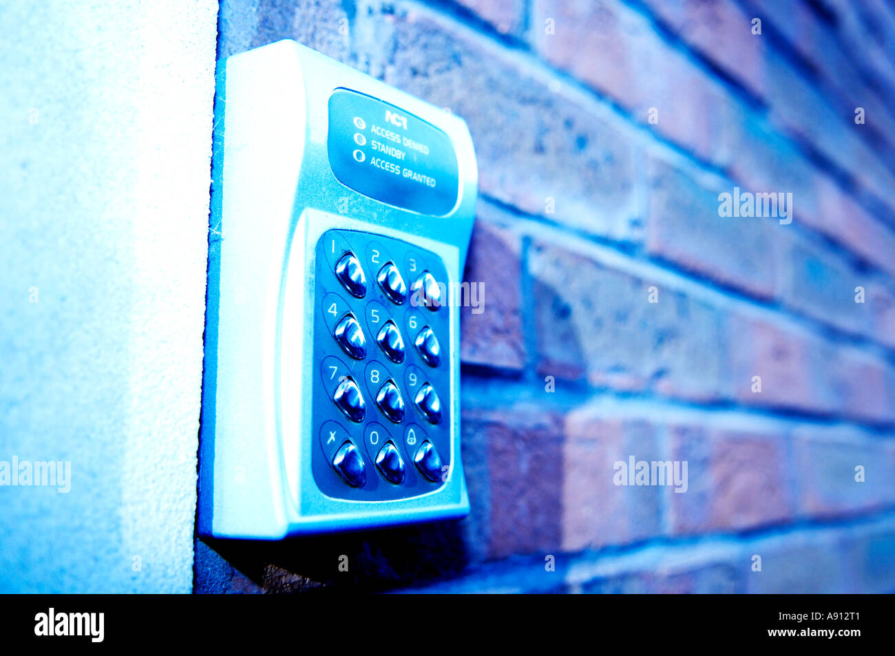 Wall mounted security entrance pad on office exterior door Stock Photo ...