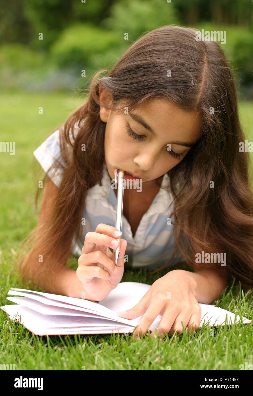 Girl writing in diary hi-res stock photography and images - Alamy