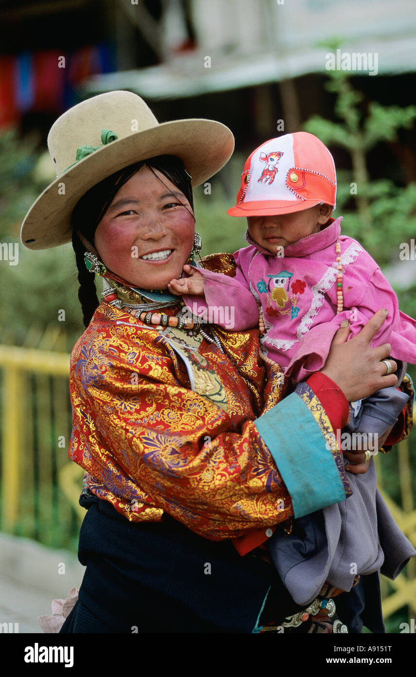 Tibetan woman with child, Xiahe, Gansu Province, China Stock Photo - Alamy