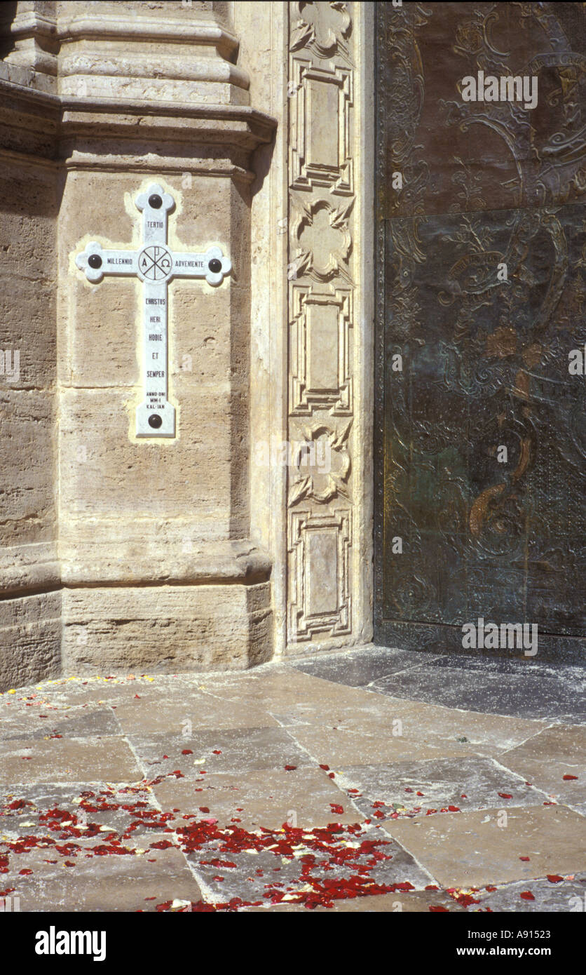 Detail of south door of cathedral with red rose petals LOCATION Pla ...