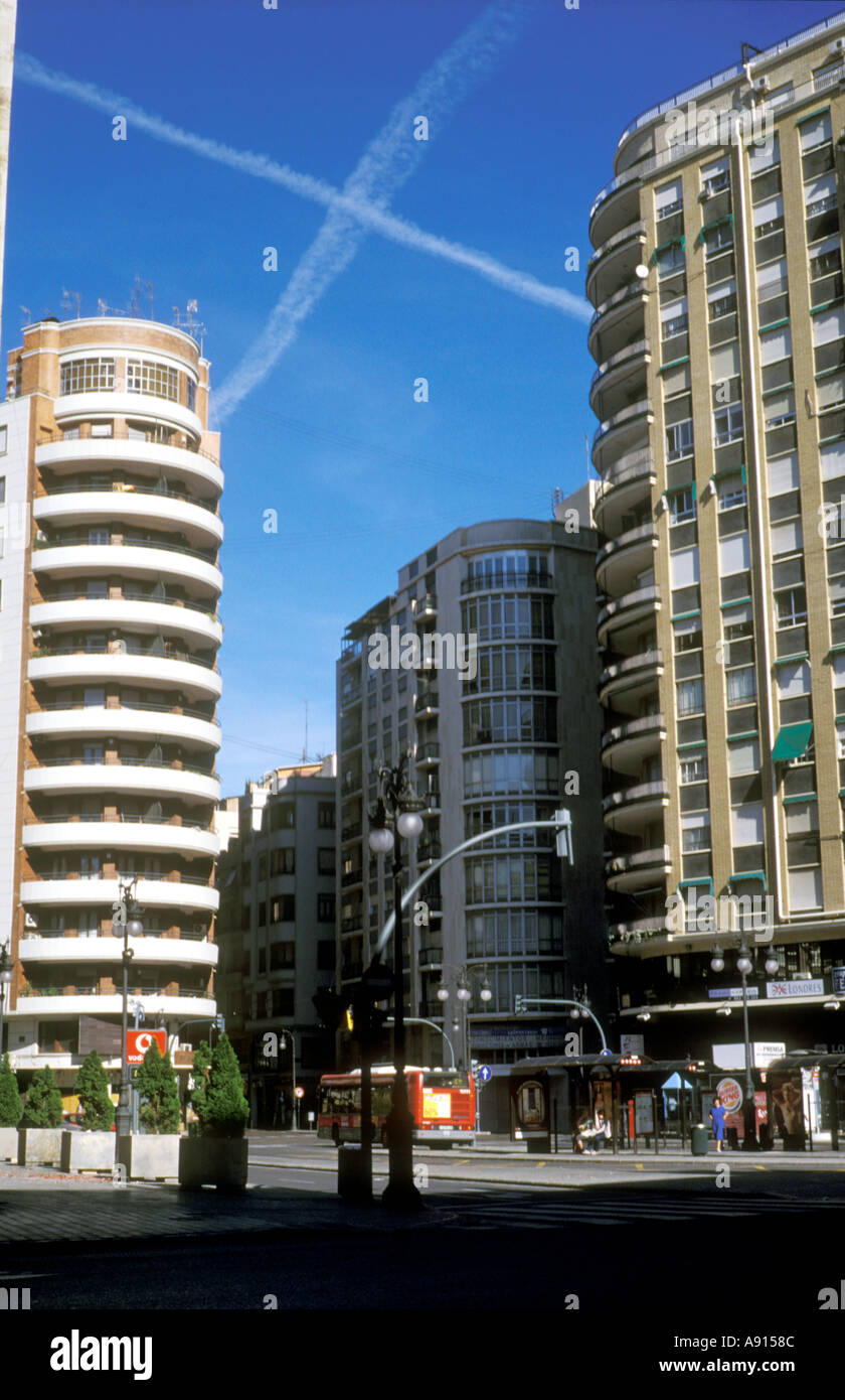 Tall buildings with blue sky and cross of vapour trails LOCATION Pla ...