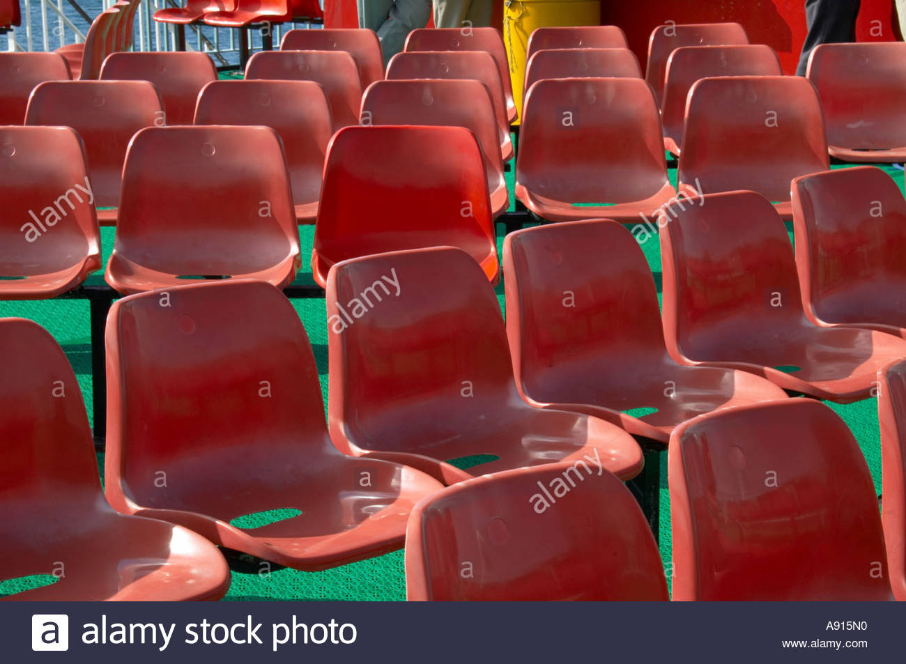 Rows of red plastic chairs Stock Photo - Alamy