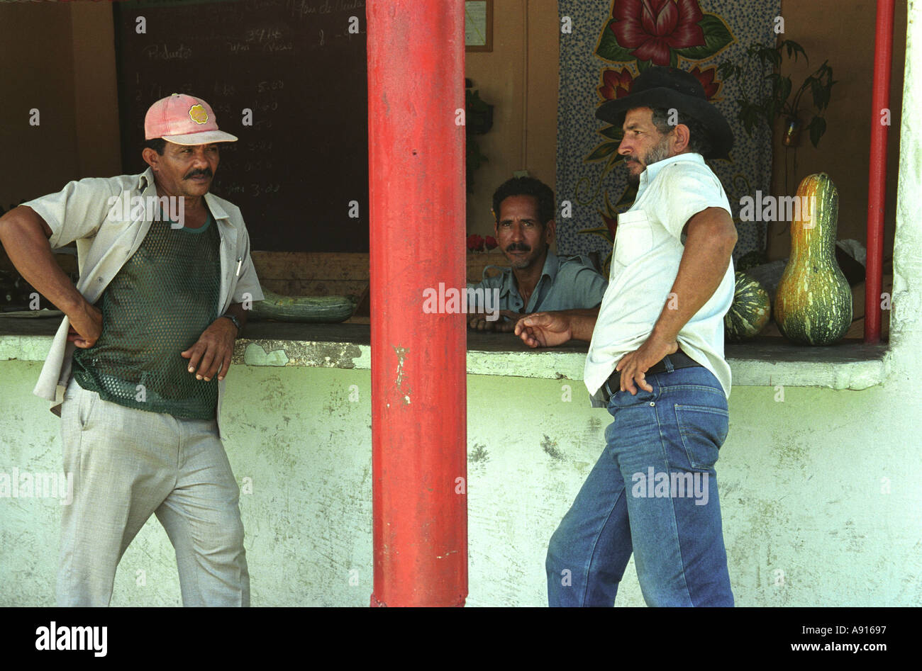 Two cuban men hanging out at a road side shop in the Sierra Maestra ...