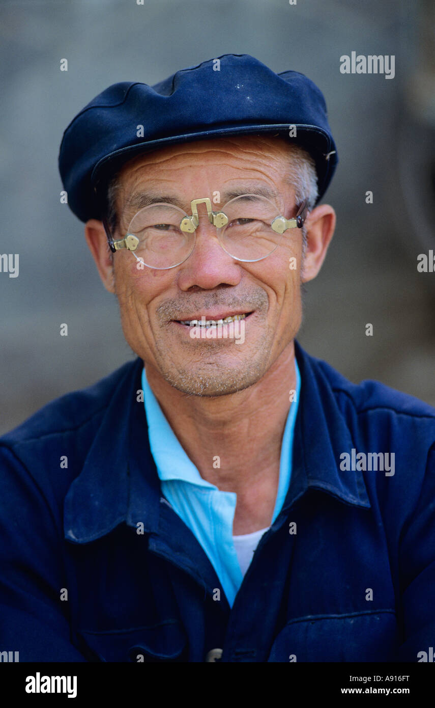 Portrait of a Chinese man wearing traditional Chinese Glasses, Dunhuang ...