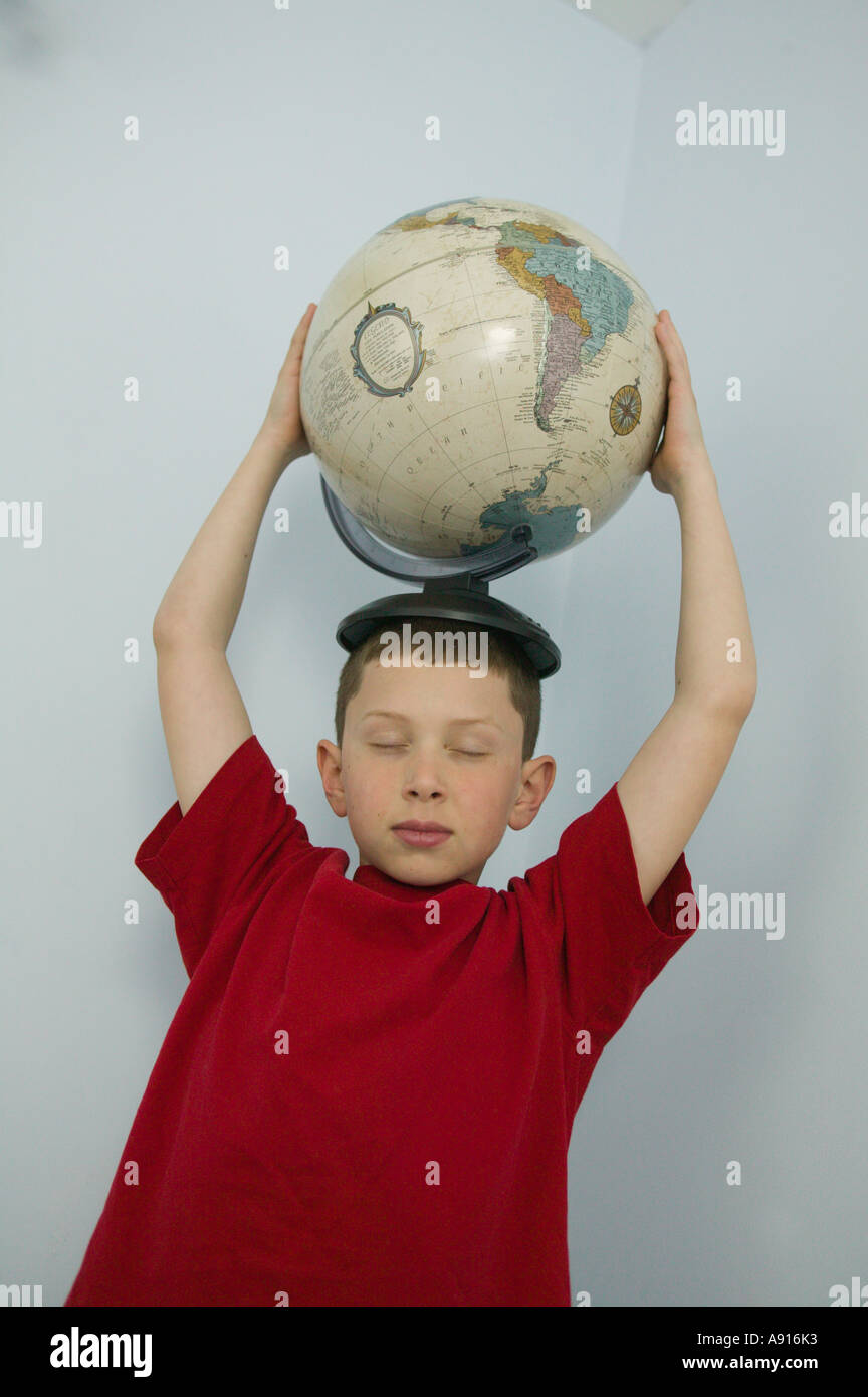 Boy with Globe on Top of Head Stock Photo - Alamy