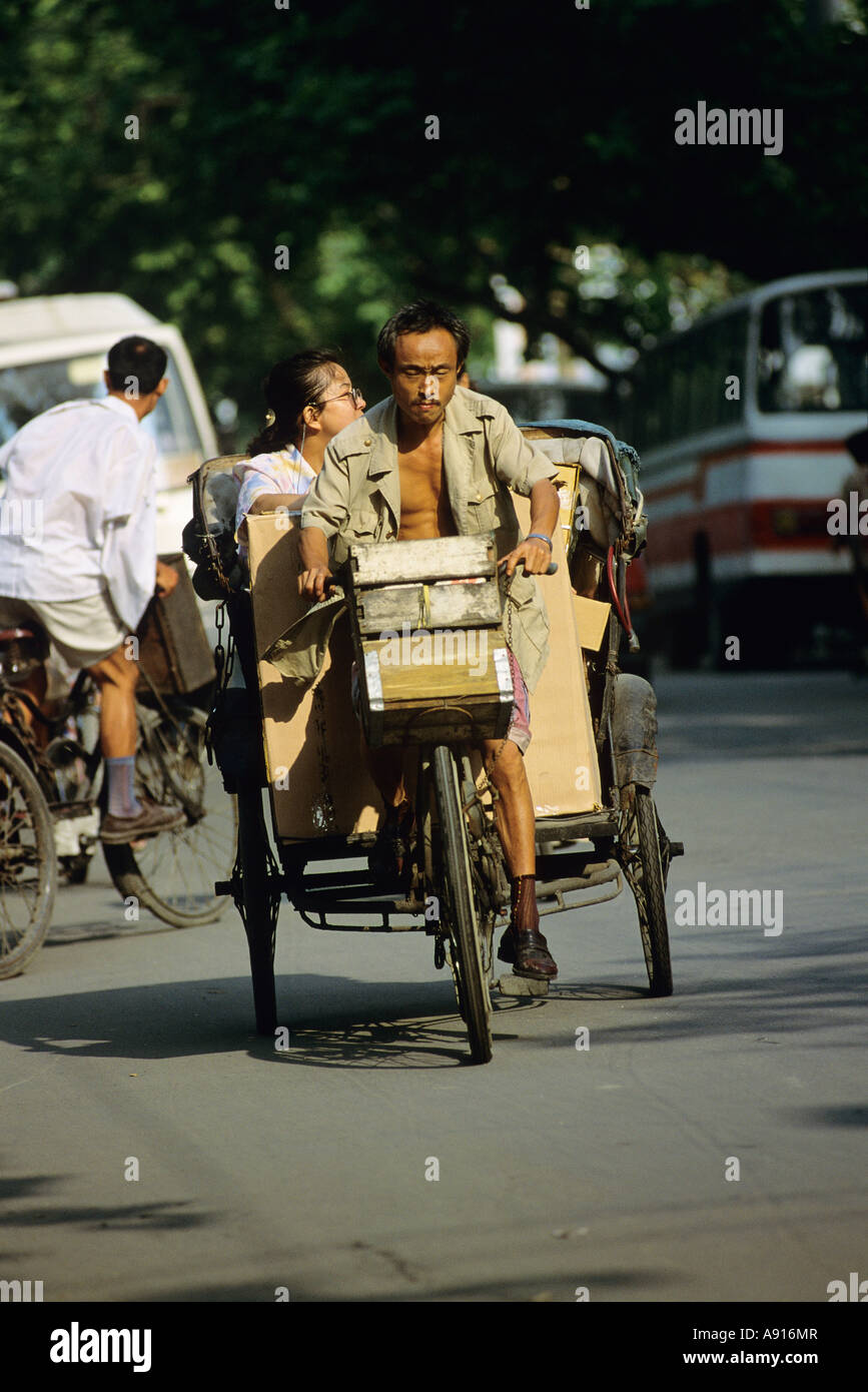 Man transporting goods using a bicycle rickshaw, Beijing, China Stock ...