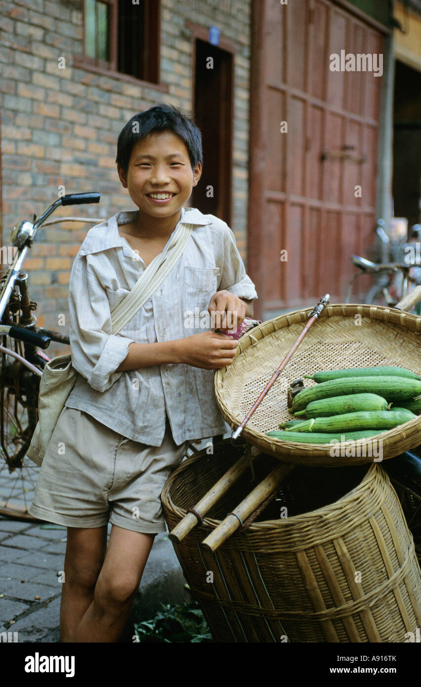 Portrait of a Chinese boy selling vegetables on the street, Chengdu ...