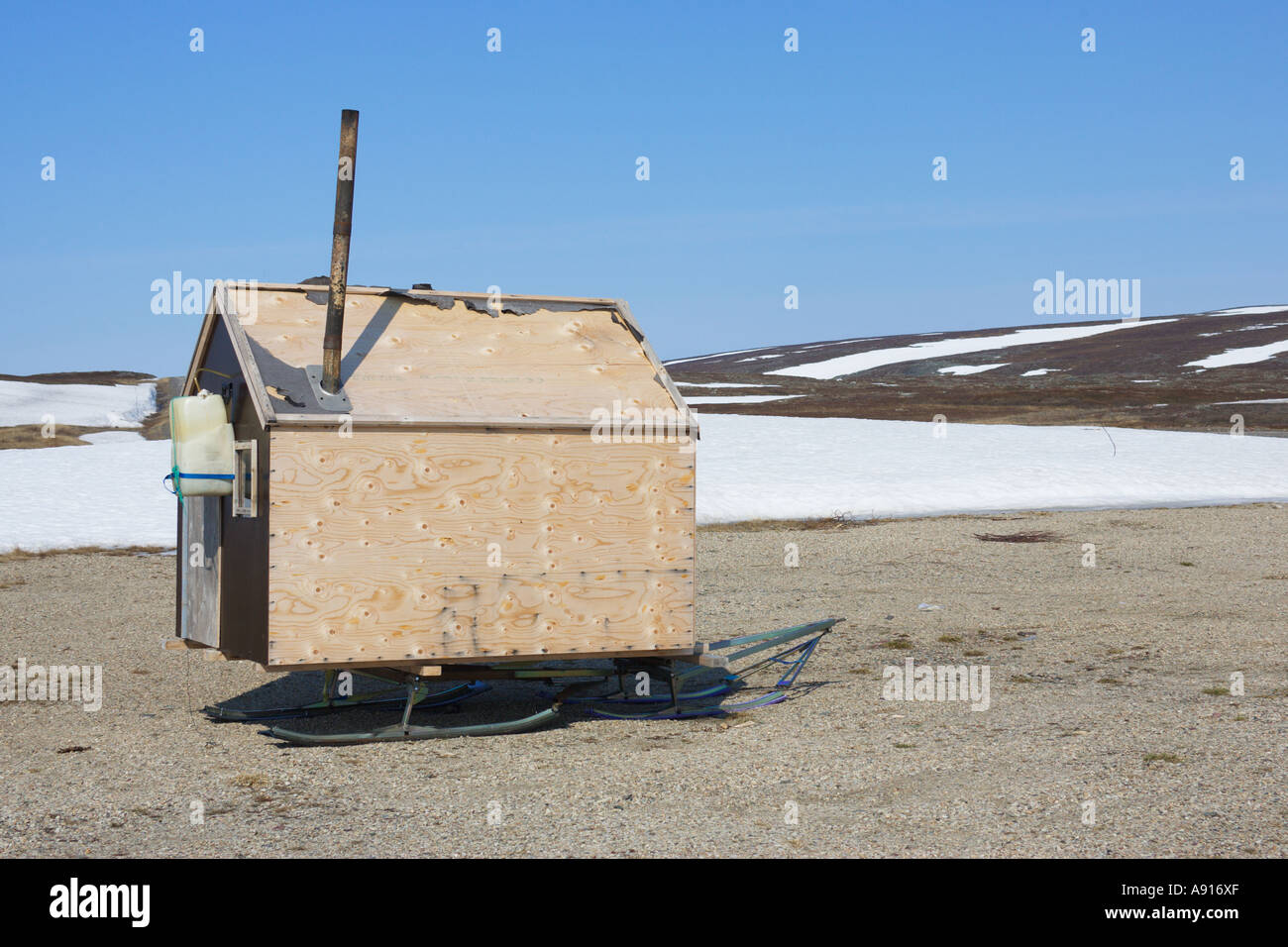 Hut on skis in snowy Arctic tundra landscape Stock Photo - Alamy