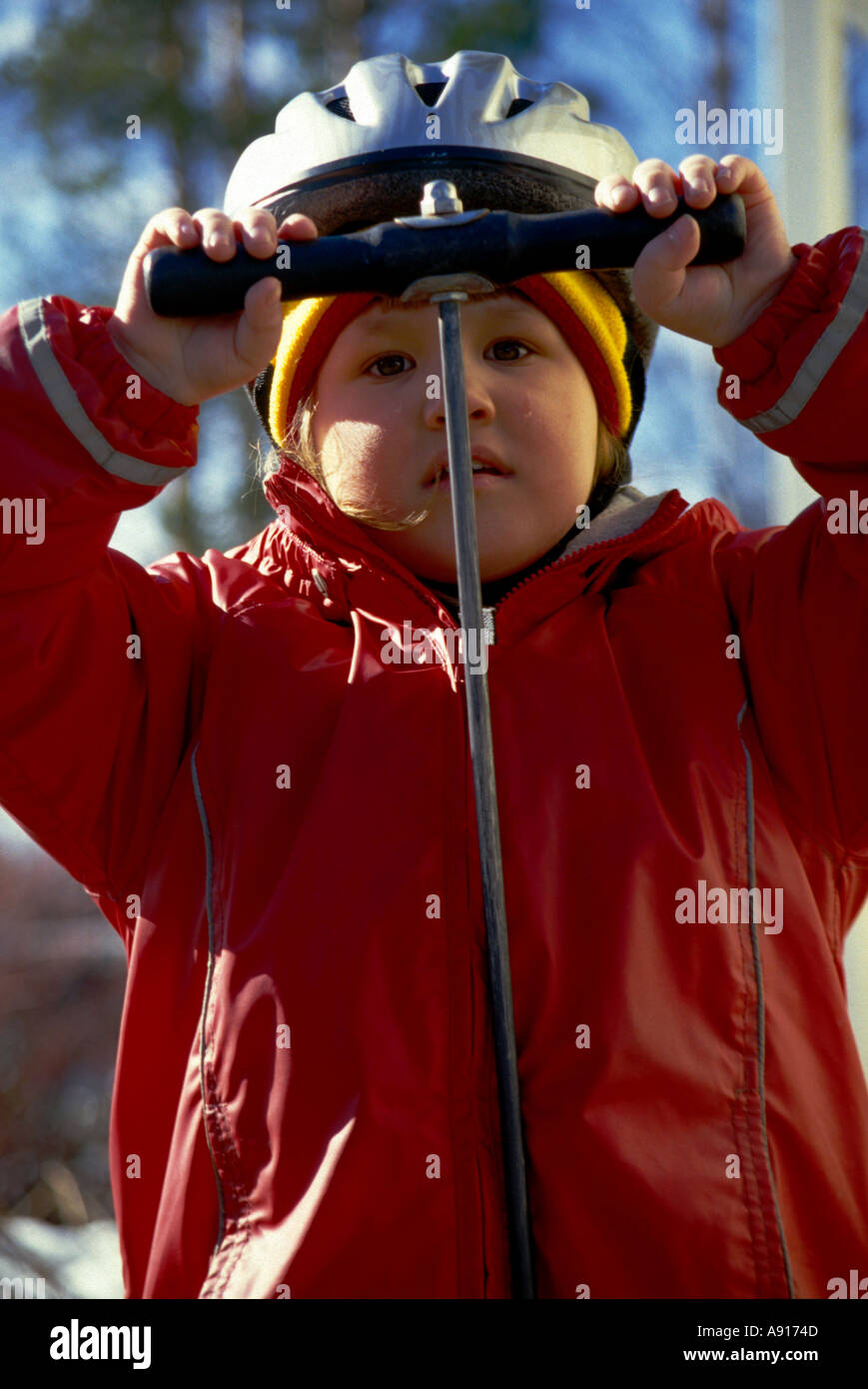 Crying girl with bicykle helmet Stock Photo - Alamy