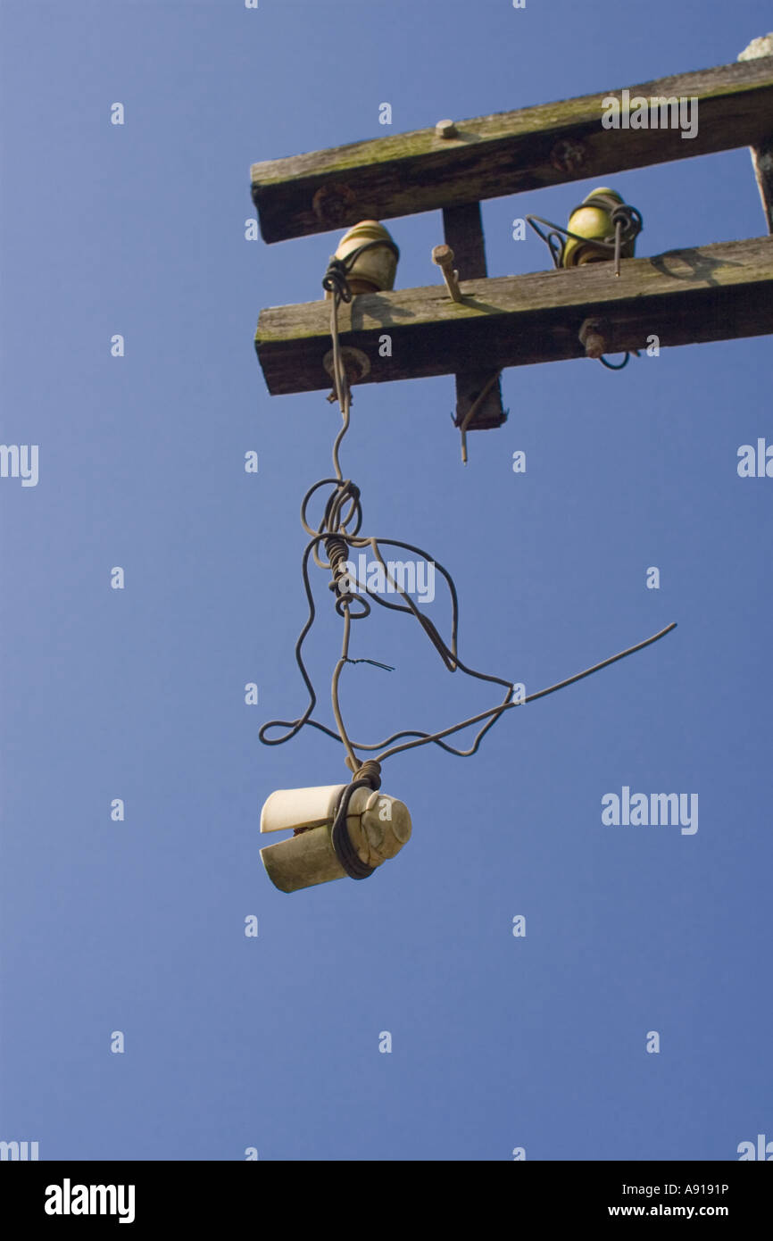 Telegraph wire in state of decay and collapse Stock Photo - Alamy