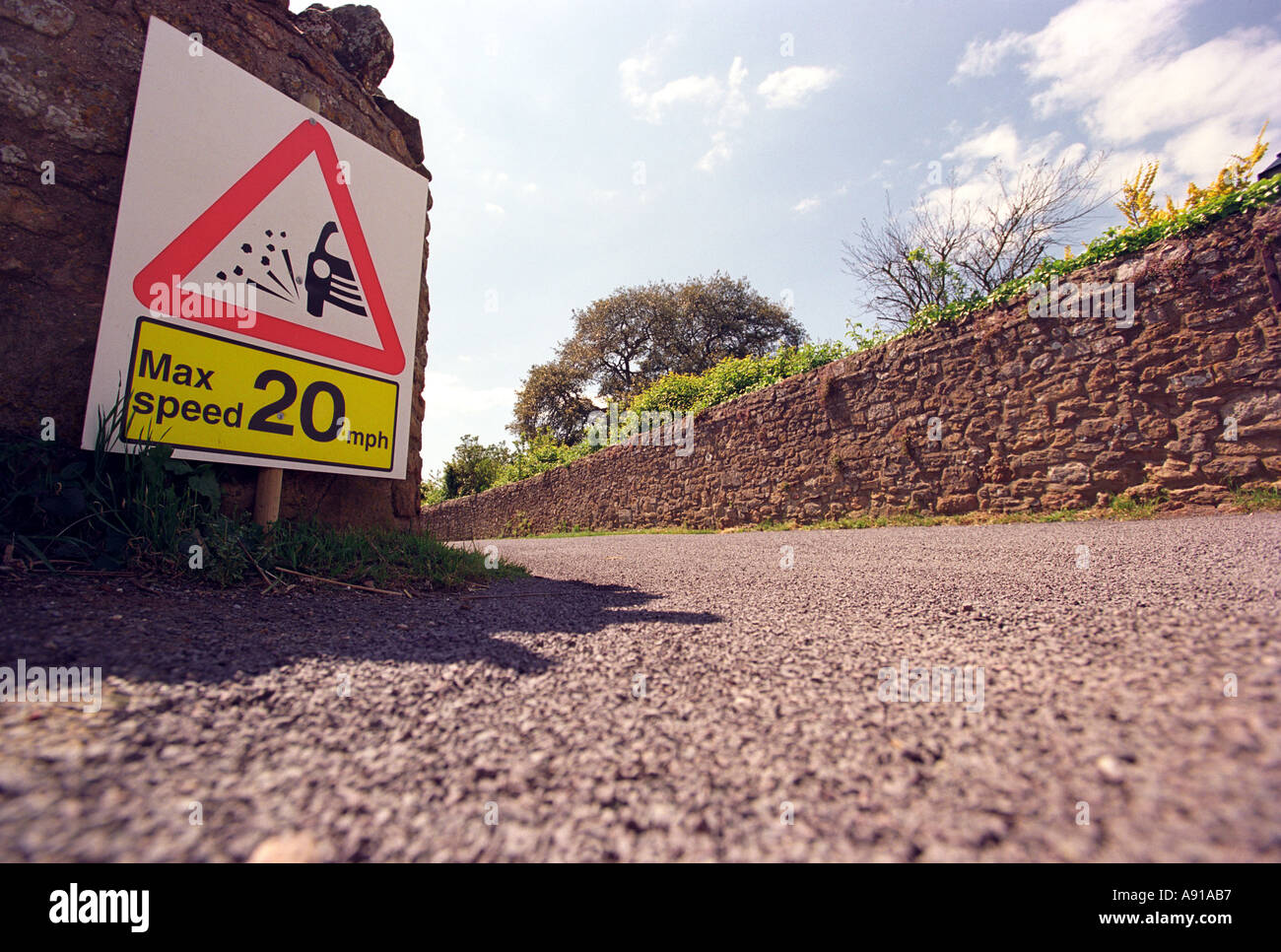 Speed warning sign for loose chippings on a country road in Dorset ...