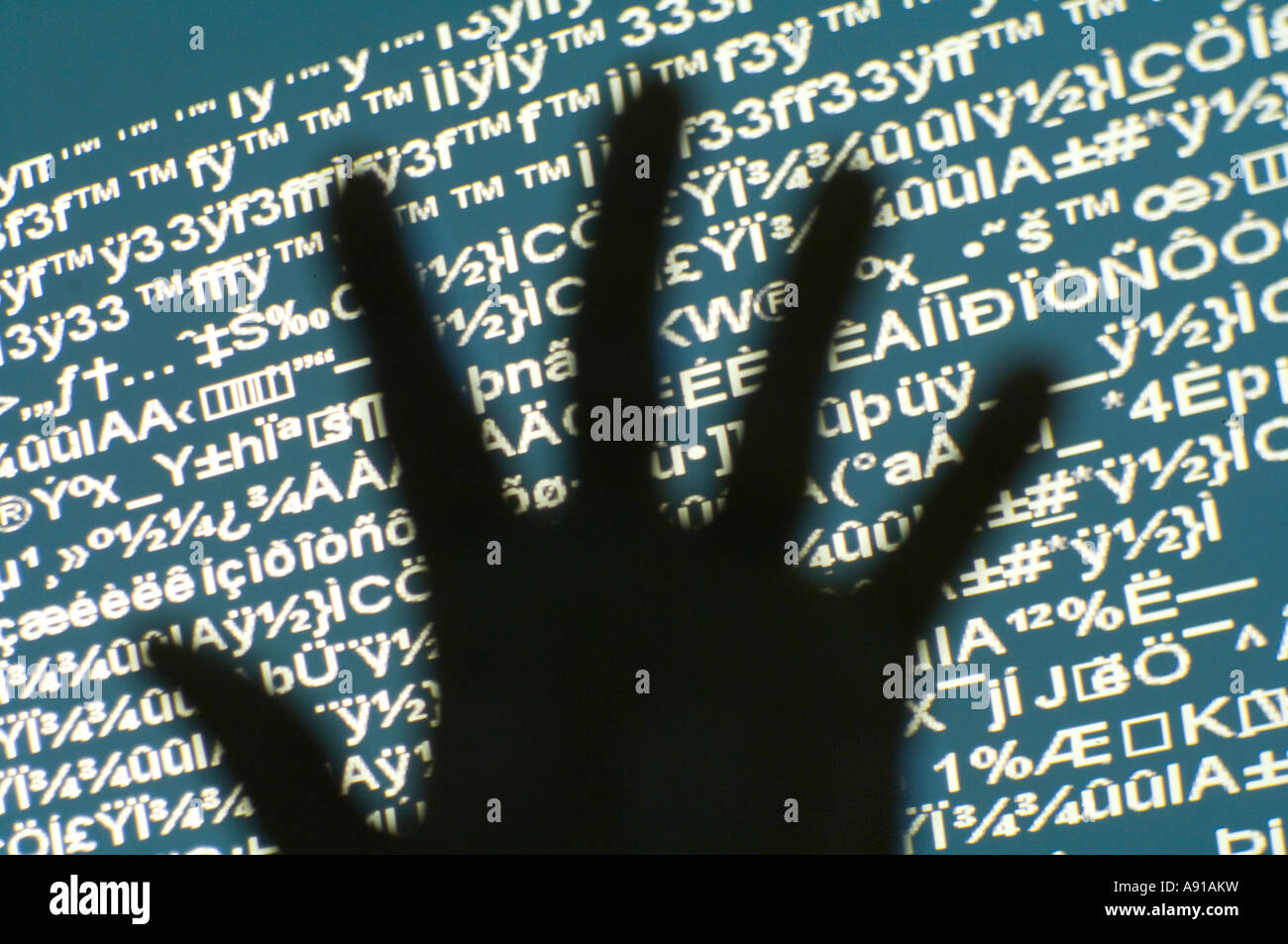 silhouette of a hand composited on programming code screen Stock Photo ...