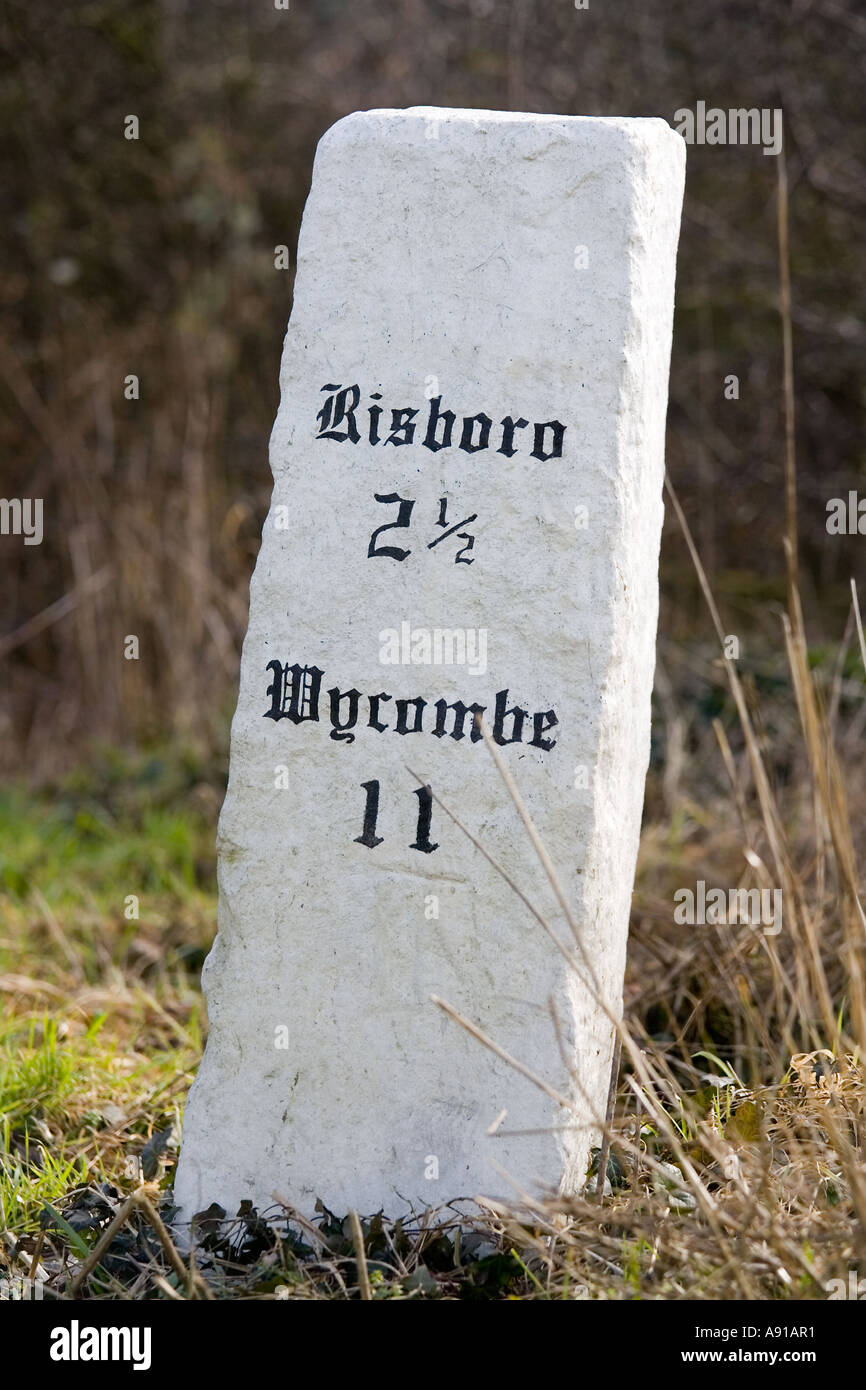 A traditional British road sign showing distances to two local towns ...