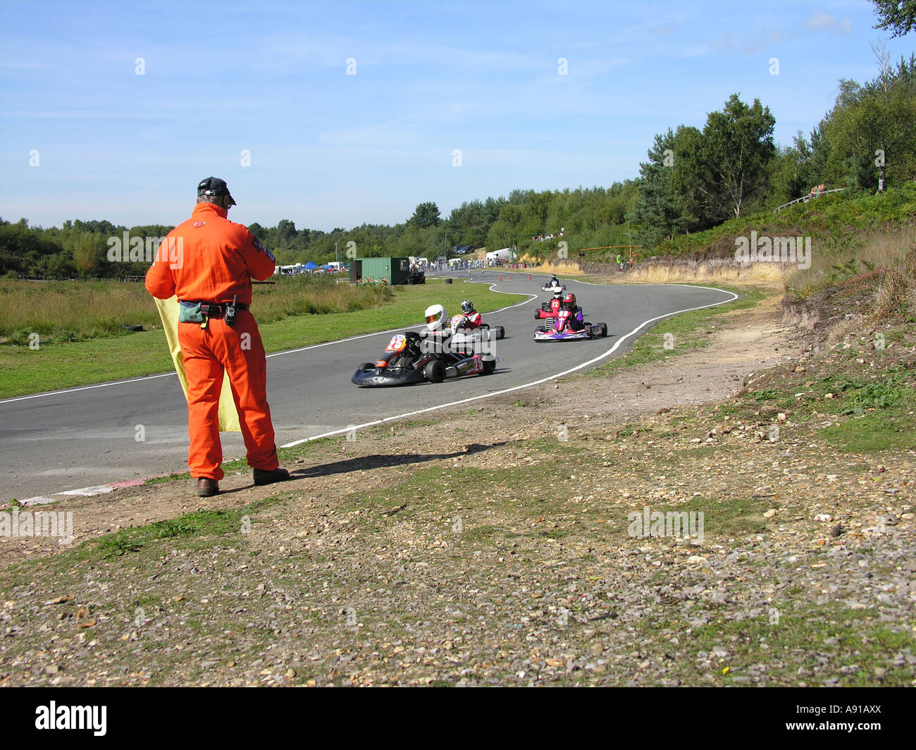 A race marshall stood beside the race track Stock Photo - Alamy