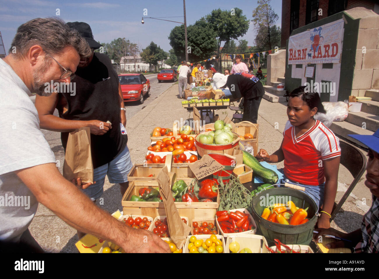 Woman children selling fruit hi-res stock photography and images - Alamy