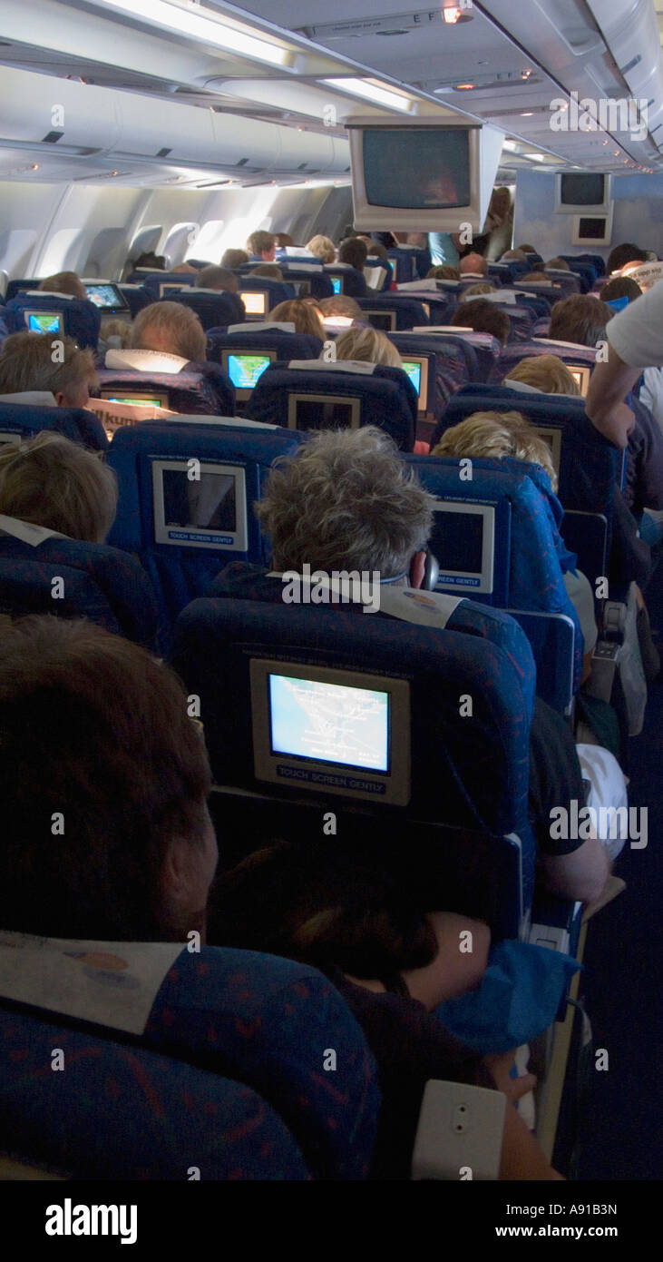 Crowded cabin in a charter flight Stock Photo - Alamy