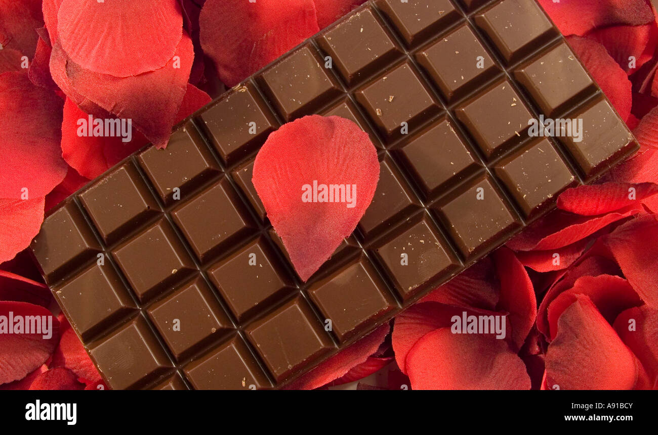 A slab of chocolate on rose petals Stock Photo - Alamy