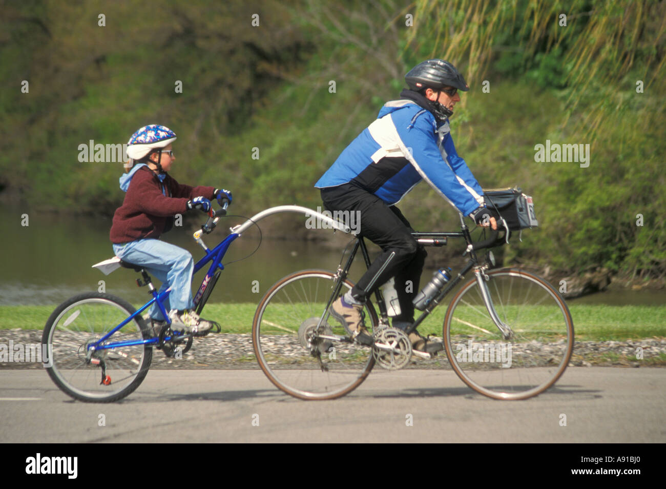 Man girl riding tandem bicycle hi-res stock photography and images - Alamy