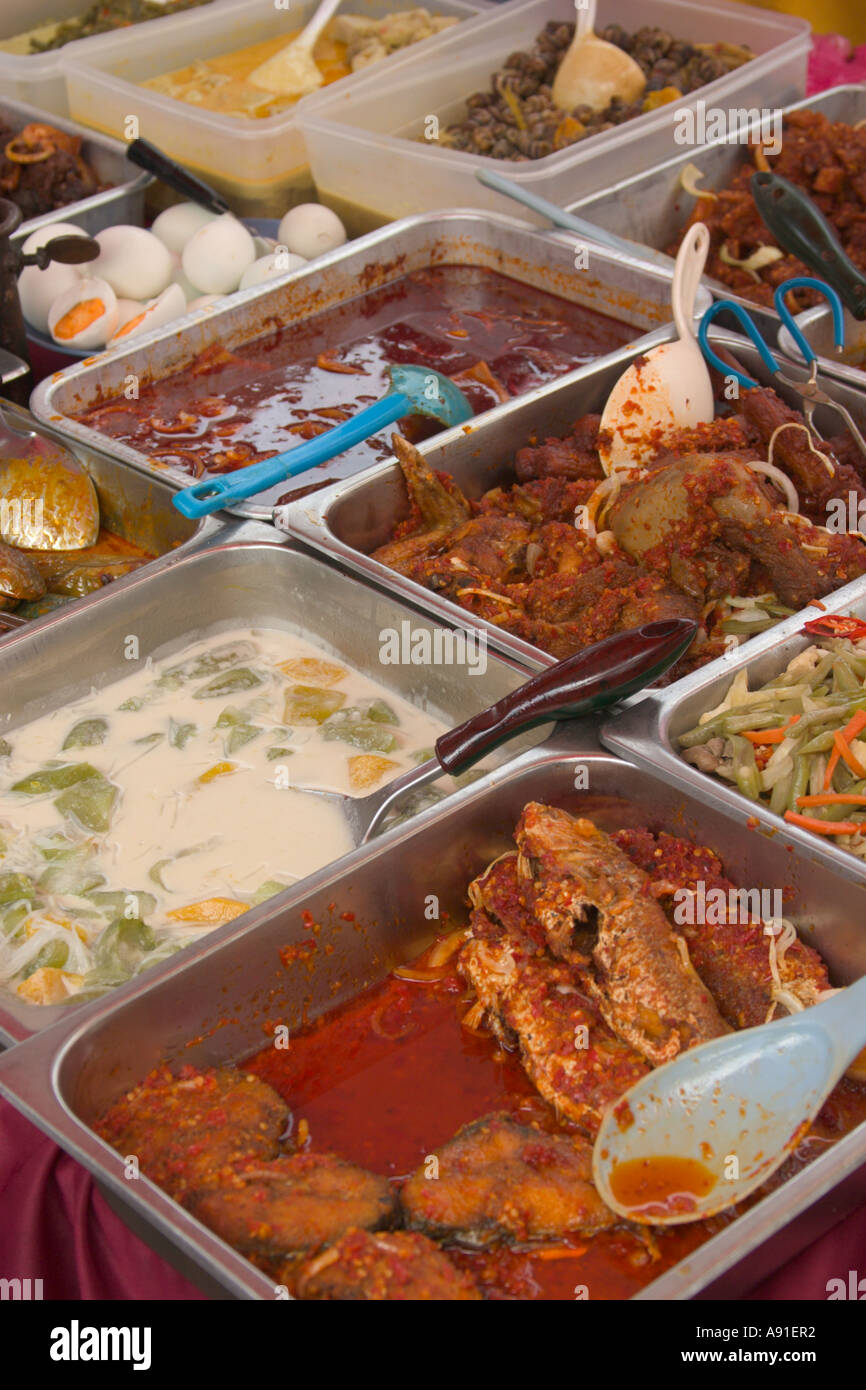 trays of variety of malay food sold at a stall Stock Photo - Alamy