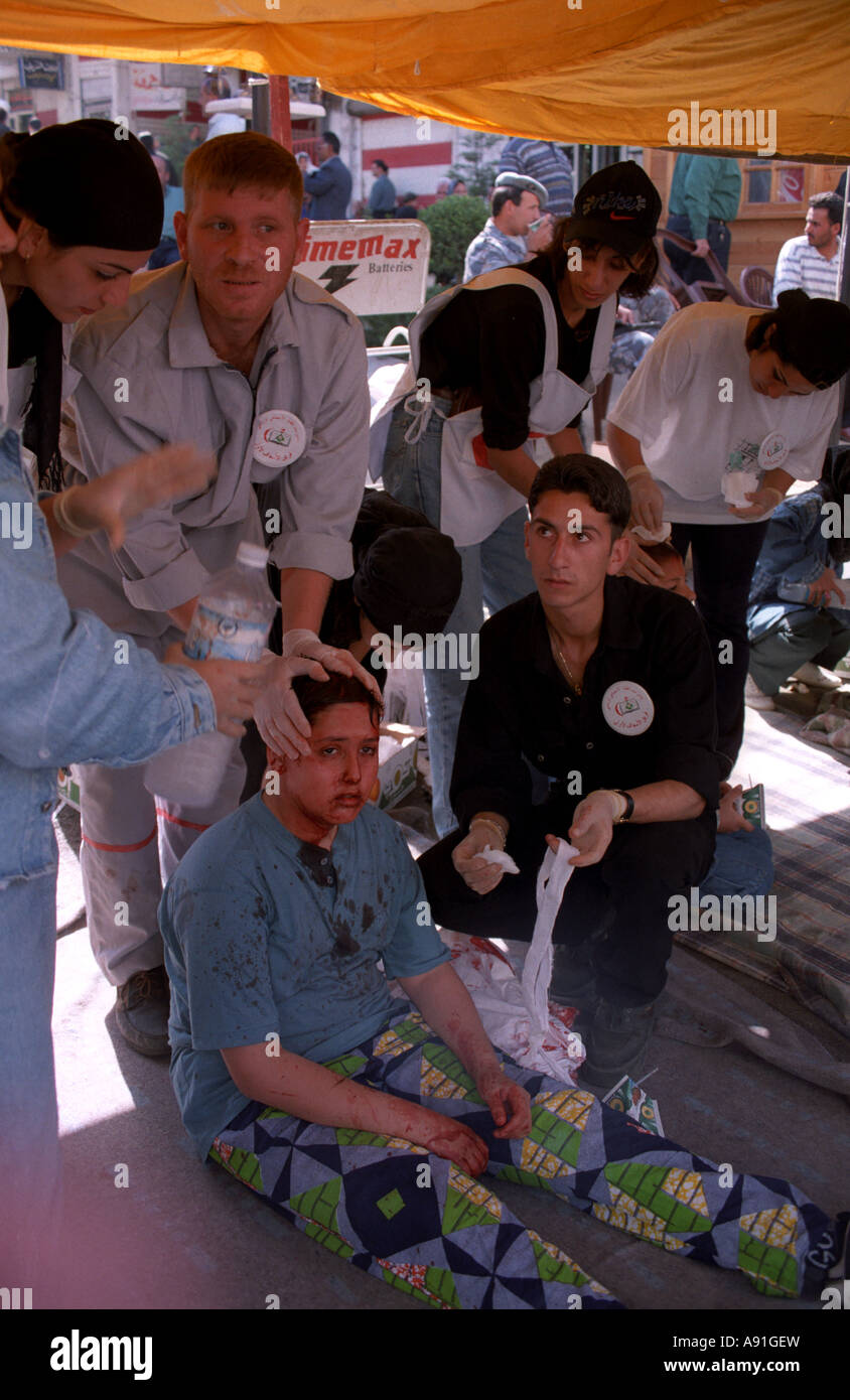 Medics helping bleeding wounded teenager boy Lebanon Middle East Stock ...